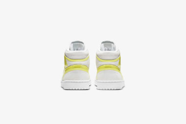 Une Air Jordan 1 Mid aux accents jaune fluo rejoint l'eshop de Nike